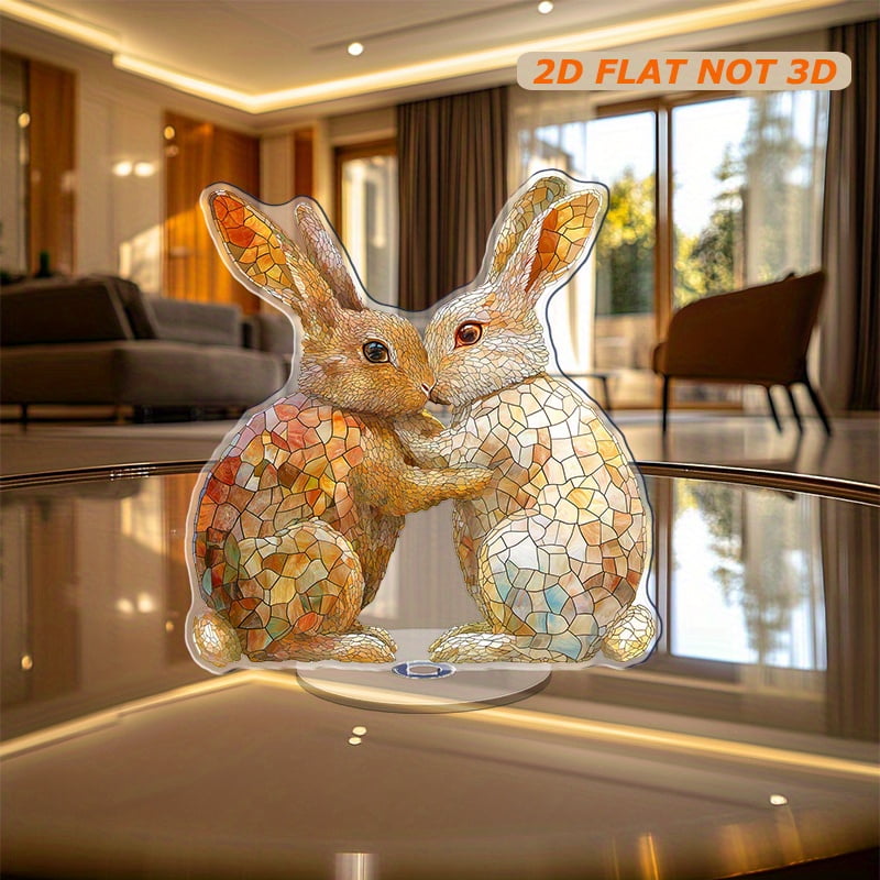 Rotating acrylic sculpture featuring two rabbits snuggling together in ...