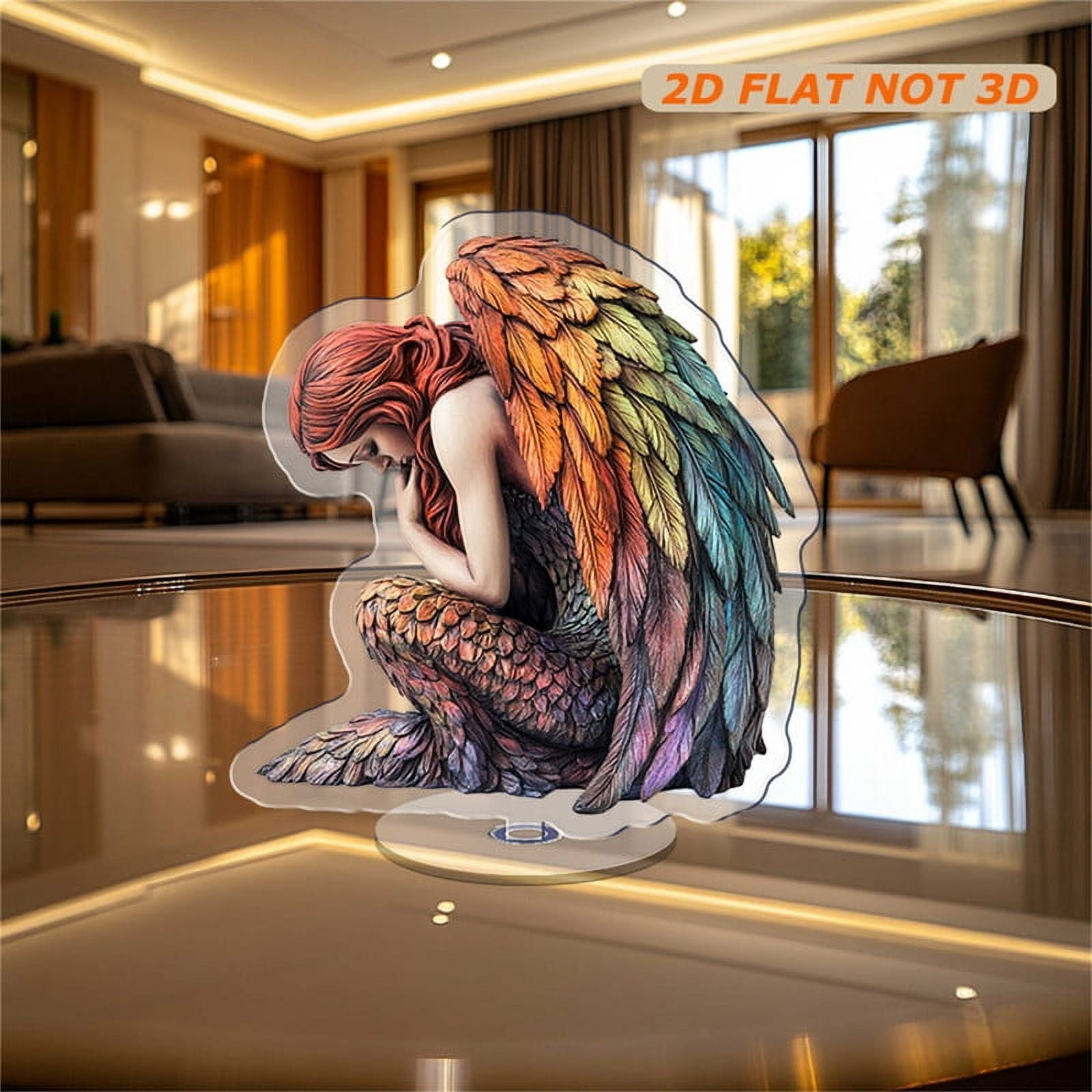 Rotating acrylic sculpture of a kneeling angel with feathered wings in prayer featuring a vivid ...