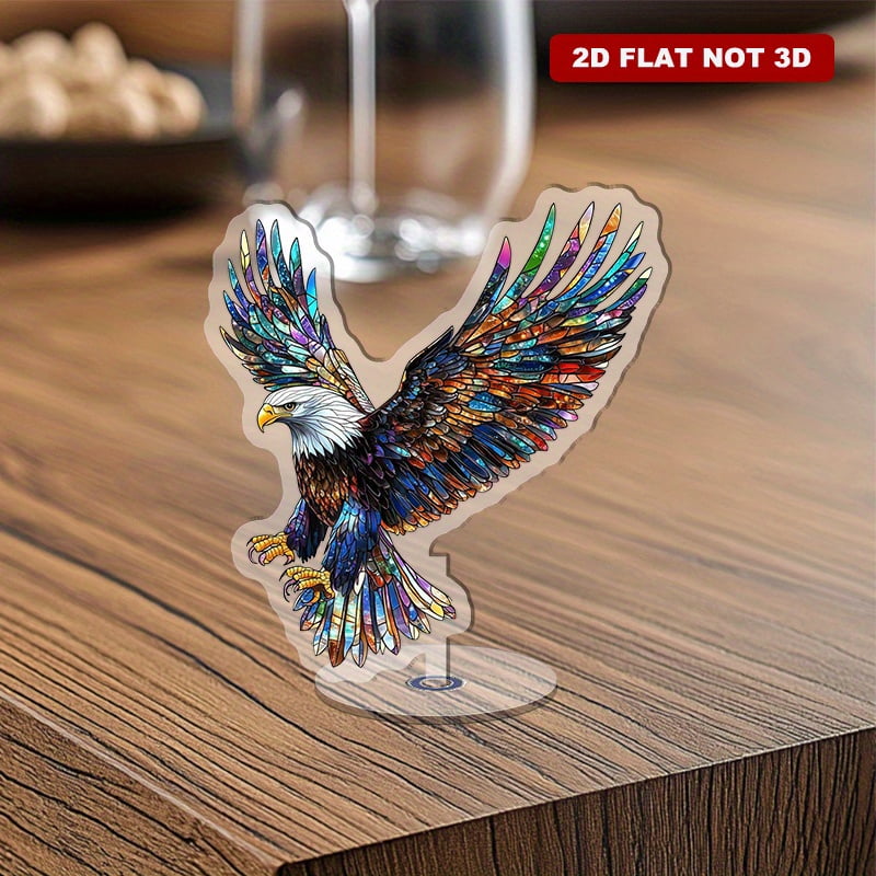 Rotating acrylic sculpture of an eagle soaring with wings spread in an ...