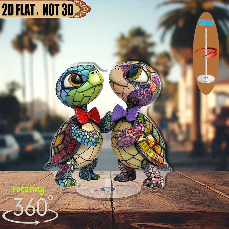 Rotating acrylic tabletop ornament featuring two intricately designed ...