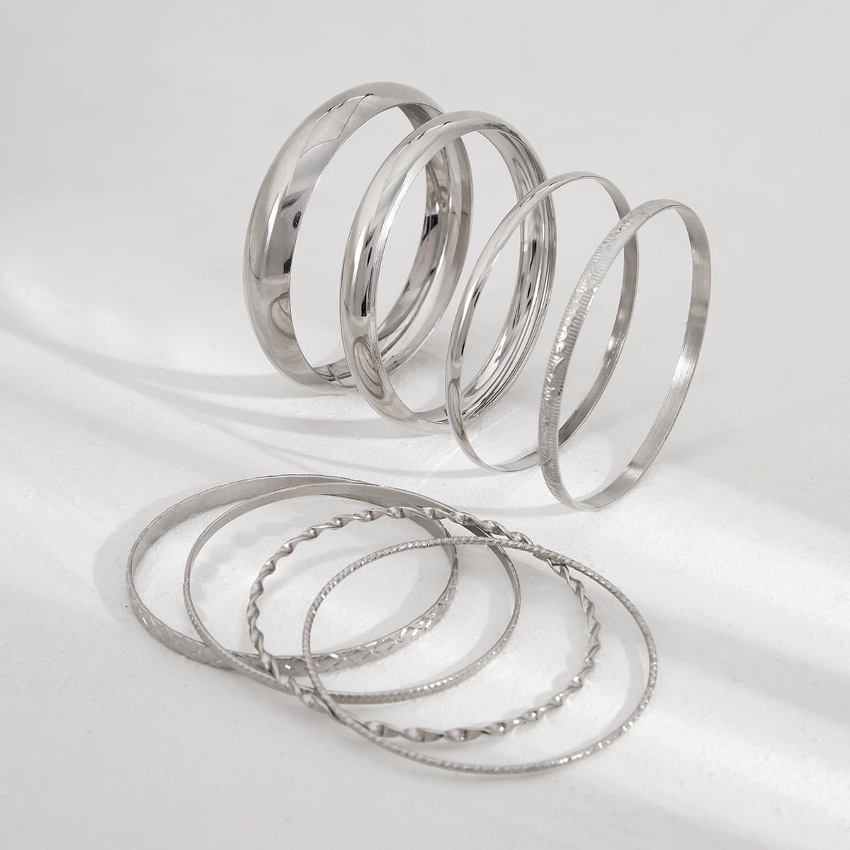 SENSHEN Eight piece set of circular bracelets, each with a unique style ...
