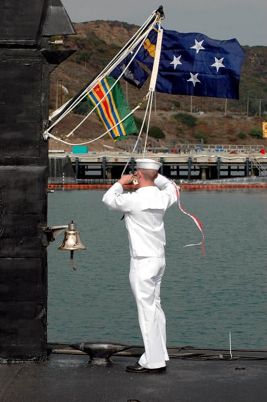 Sailor hauls down the commissioning pennant for the fast attack ...