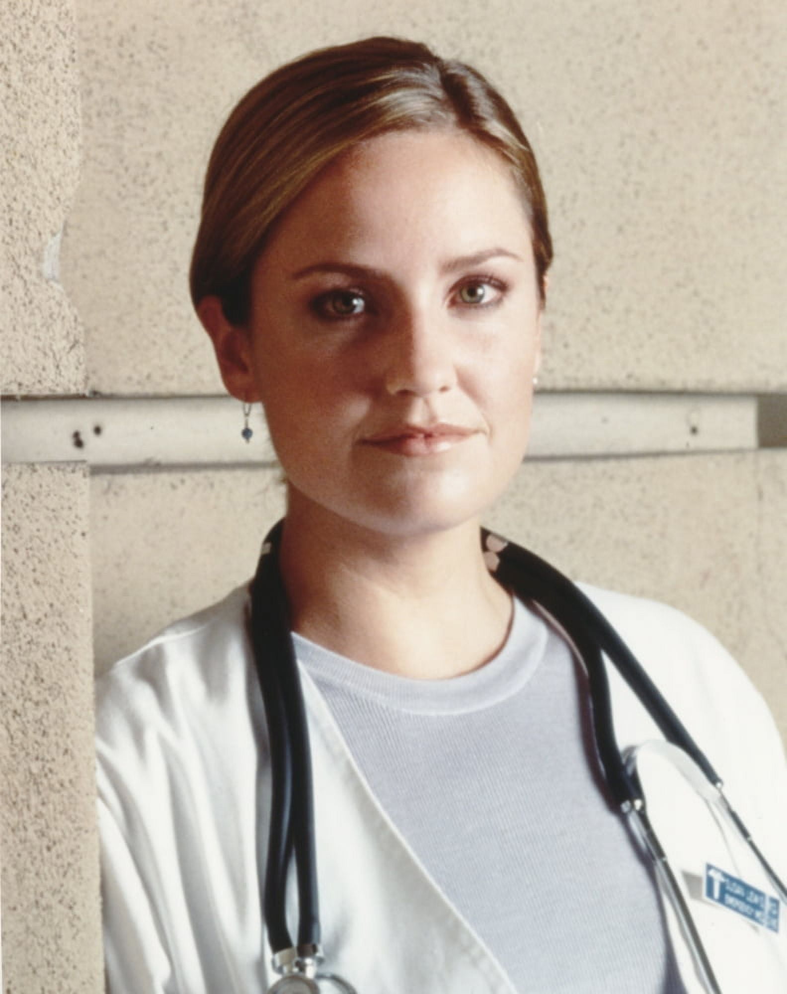 Sherry Stringfield Posed in White Long Sleeve Coat and Grey Round Neck ...