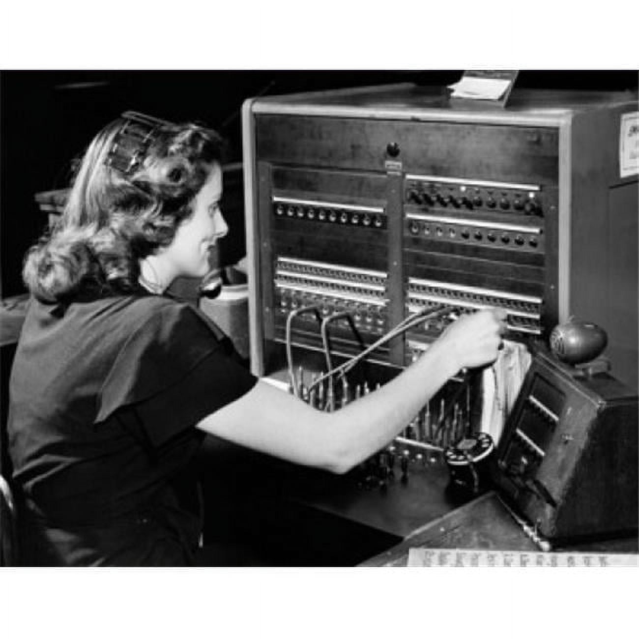 Side Profile of a Female Telephone Operator Operating a Switchboard ...