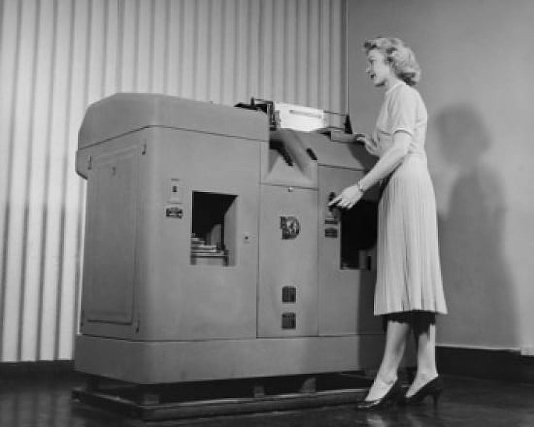 Side profile of a secretary working on a tabulating and accounting ...