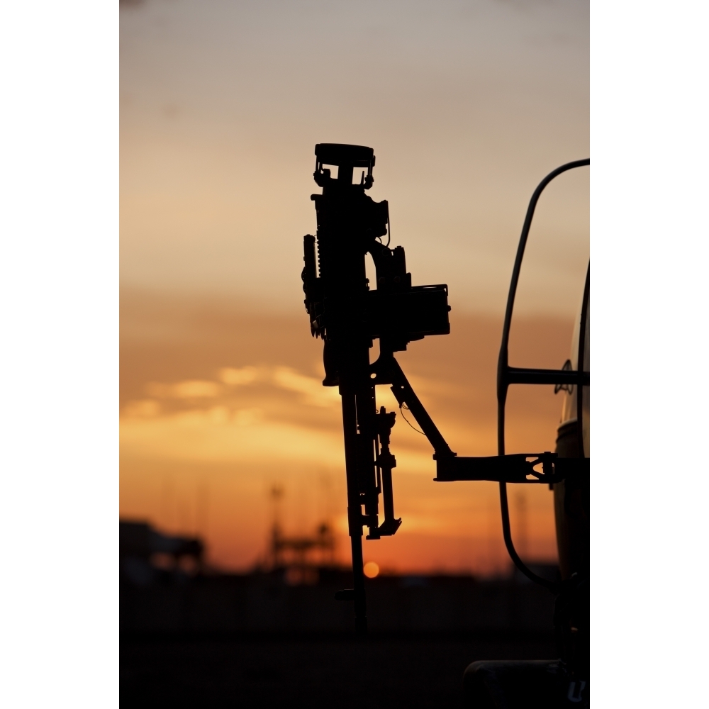 Silhouette of a M240G medium machine gun on a UH-60L Black Hawk Poster ...