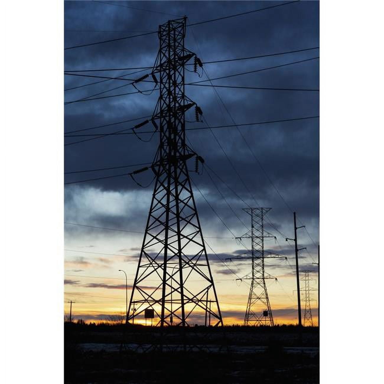 Silhouette of large metal powerline towers with glowing sky; Calgary ...
