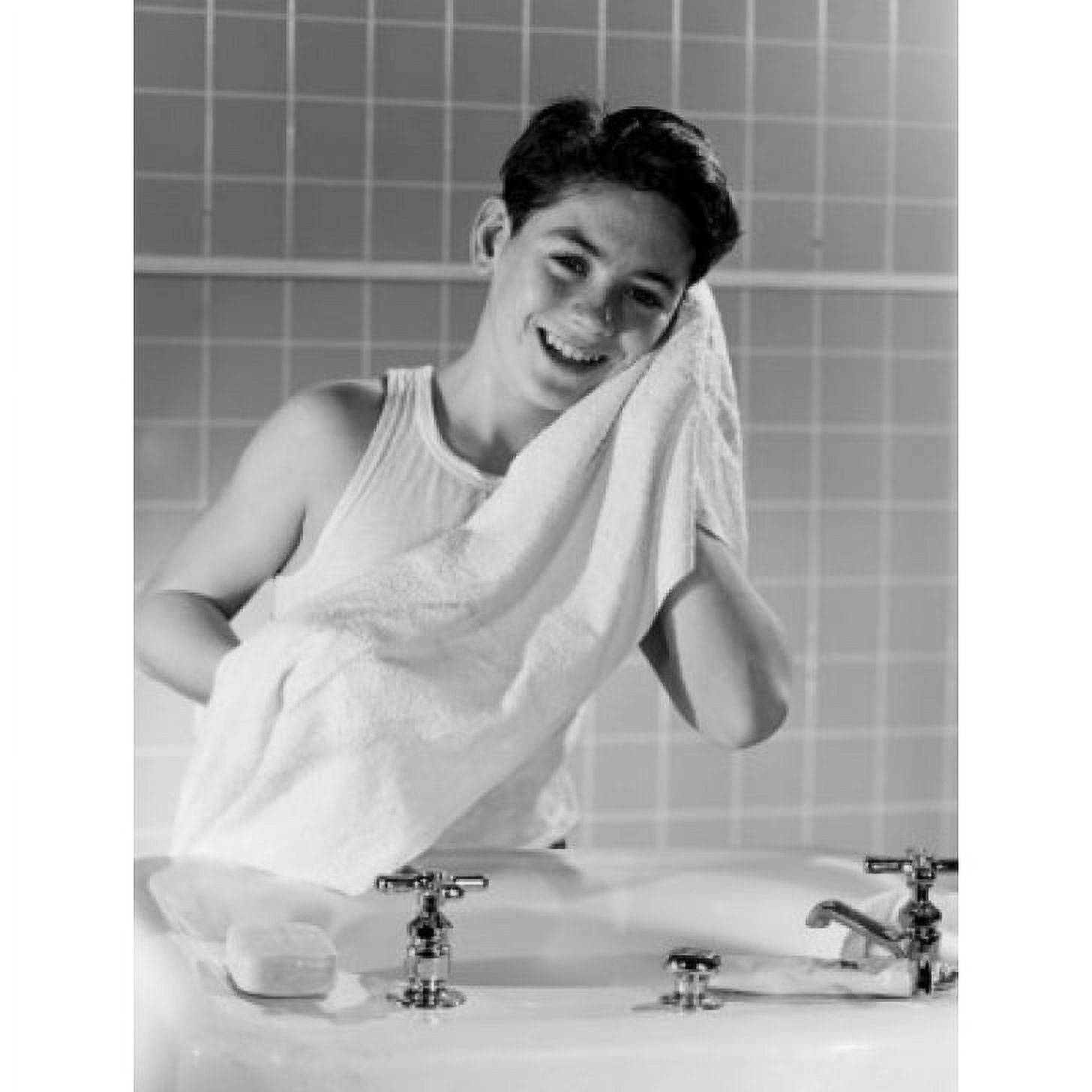 Smiling boy drying face with towel in bathroom Poster Print (18 x 24 ...