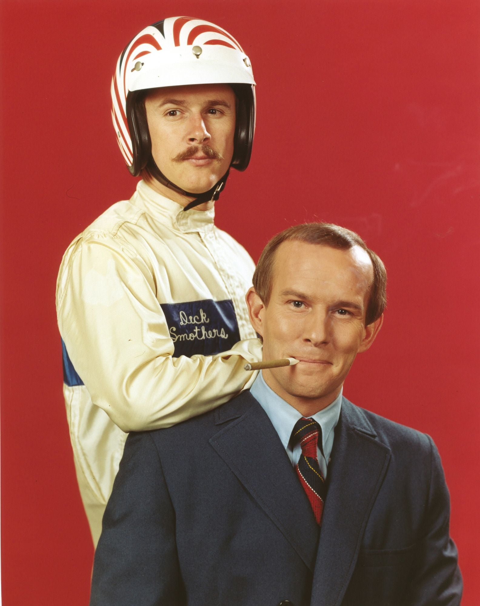 Smothers Brothers One Smoking a Cigar and the Other wearing a Helmet ...
