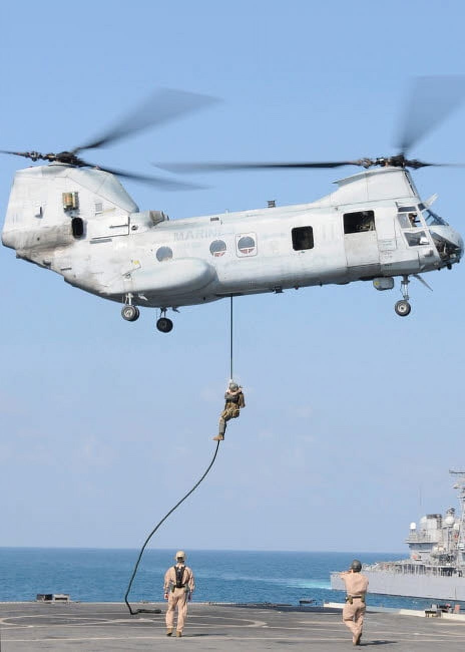 Soldiers fast rope from a CH-46E Sea Knight helicopter onto amphibious ...