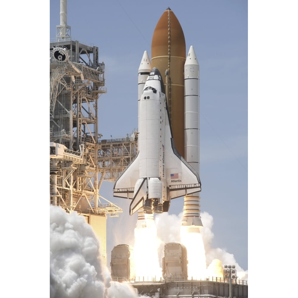 Space shuttle Atlantis twin solid rocket boosters ignite to propel ...