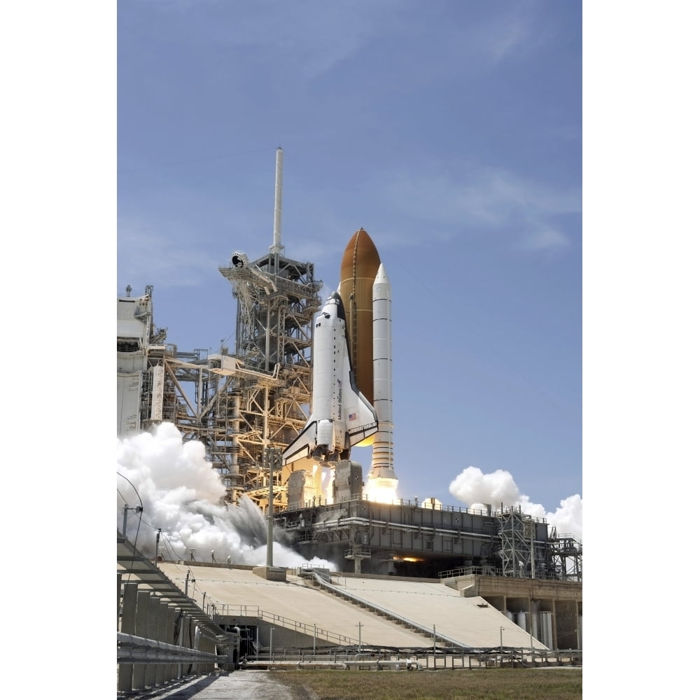 Space shuttle Atlantis twin solid rocket boosters ignite to propel ...