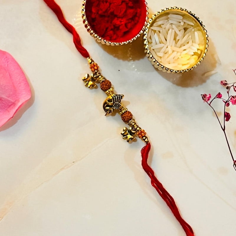 Spiritual Rakhi for Brother – Ganesha & Rudraksha Beads on Red Thread ...
