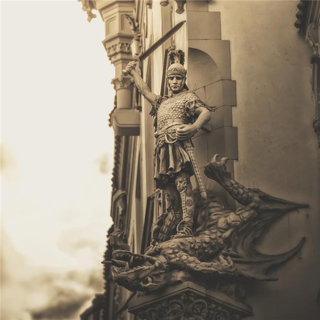 Statue on The Side of A Building of A Warrior Slaying A Dragon - Prague ...