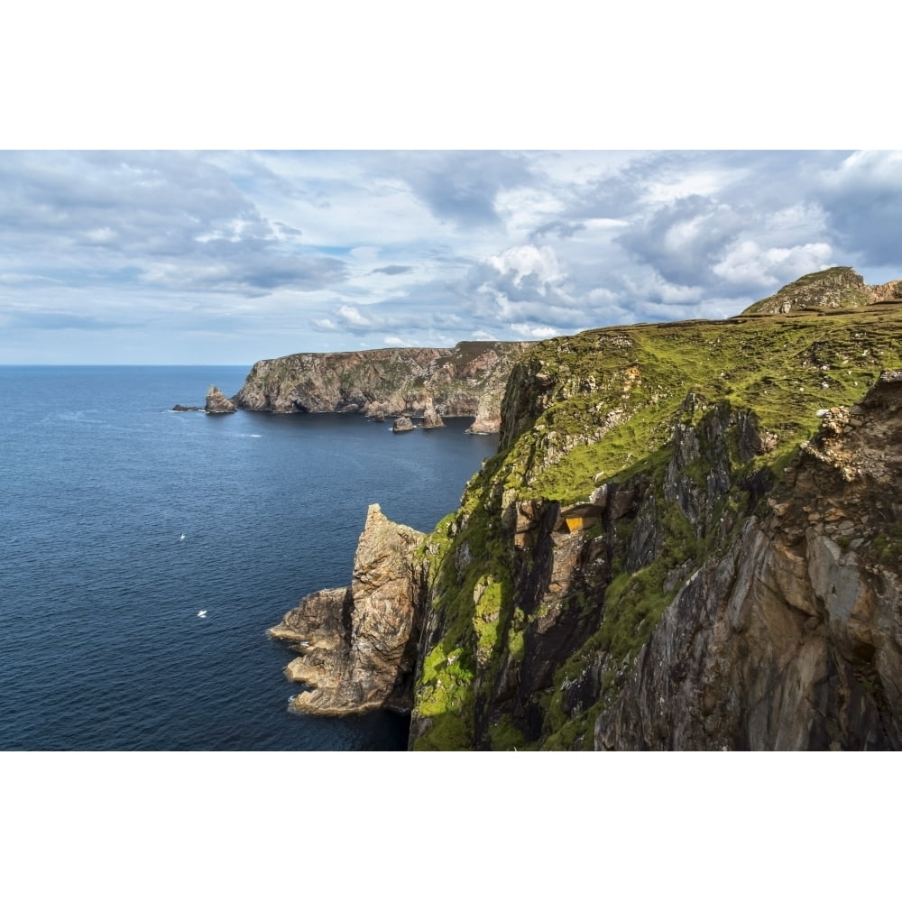 Steep cliffs along the coastline of Arranmore Island; County Donegal ...