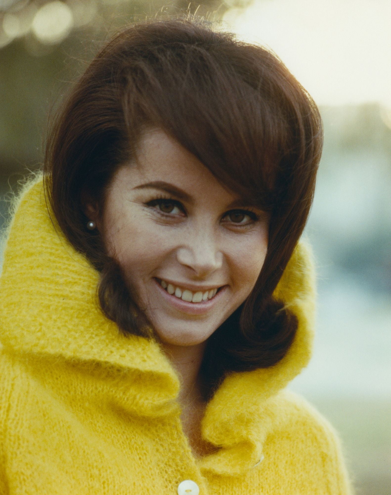 Stefanie Powers smiling in a Portrait wearing Yellow Winter Coat Photo ...