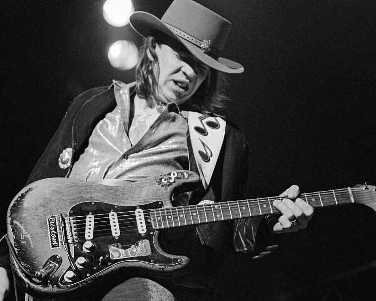 Stevie Ray Vaughan on stage performing playing his guitar 24x30 inch ...