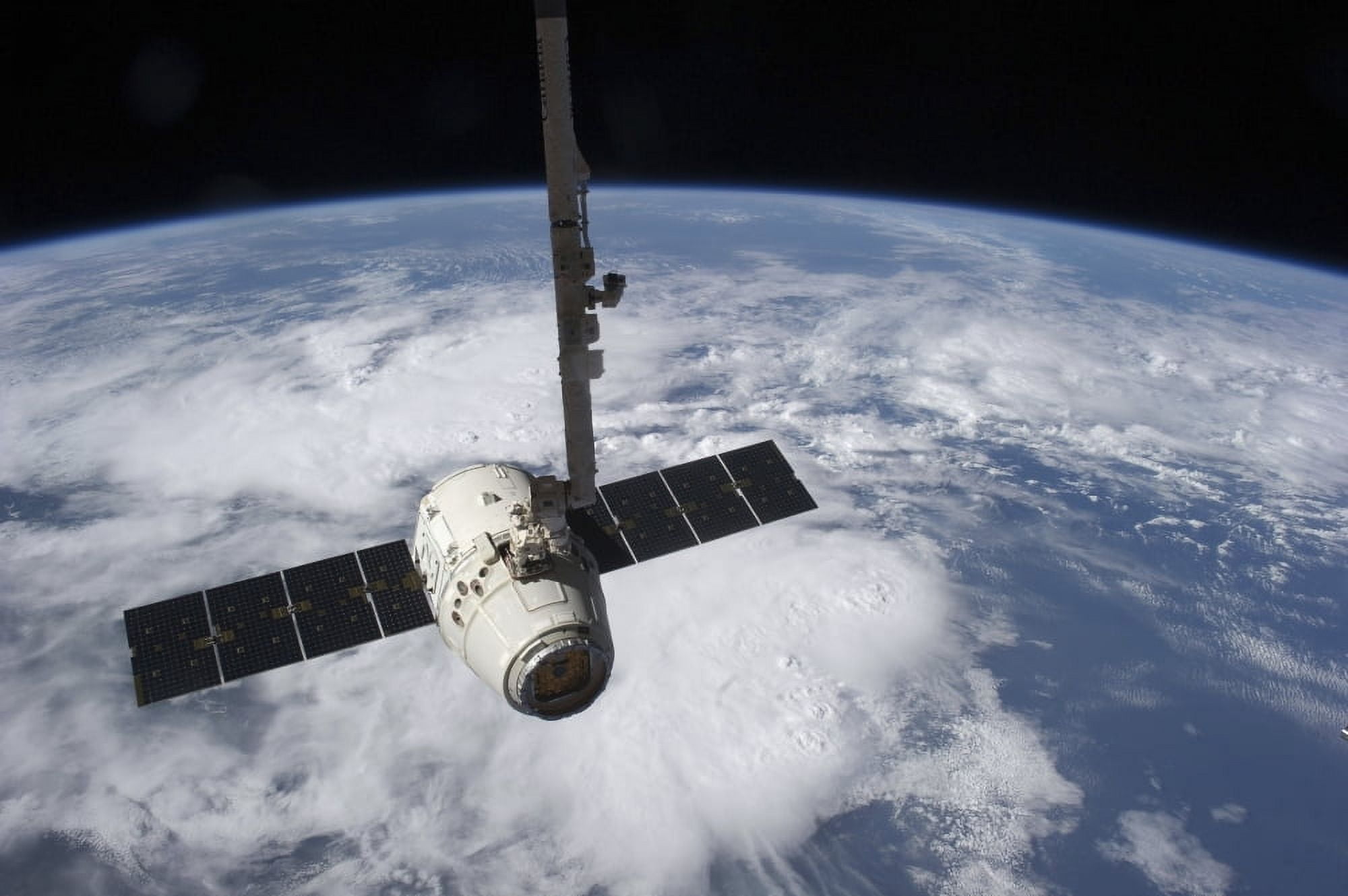 The SpaceX Dragon cargo craft prior to being released by the Canadarm2 ...