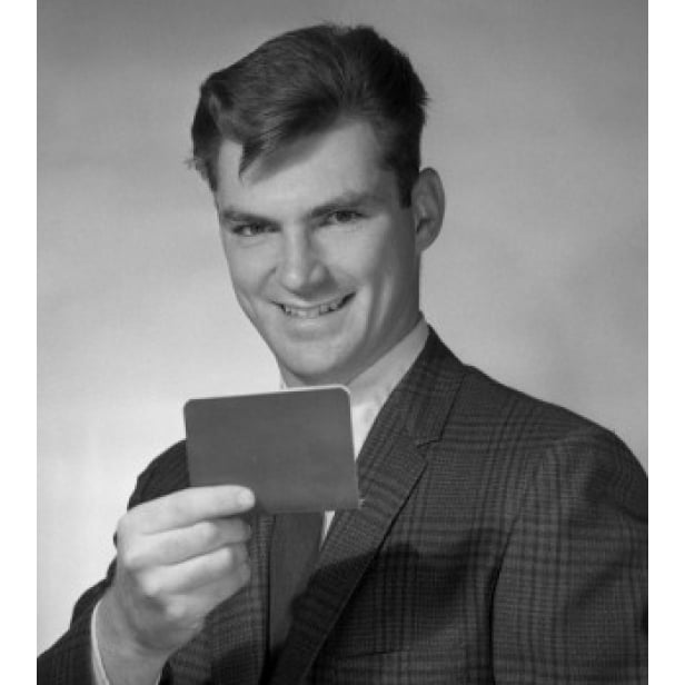 Studio portrait of male customs officer checking passport Poster Print ...