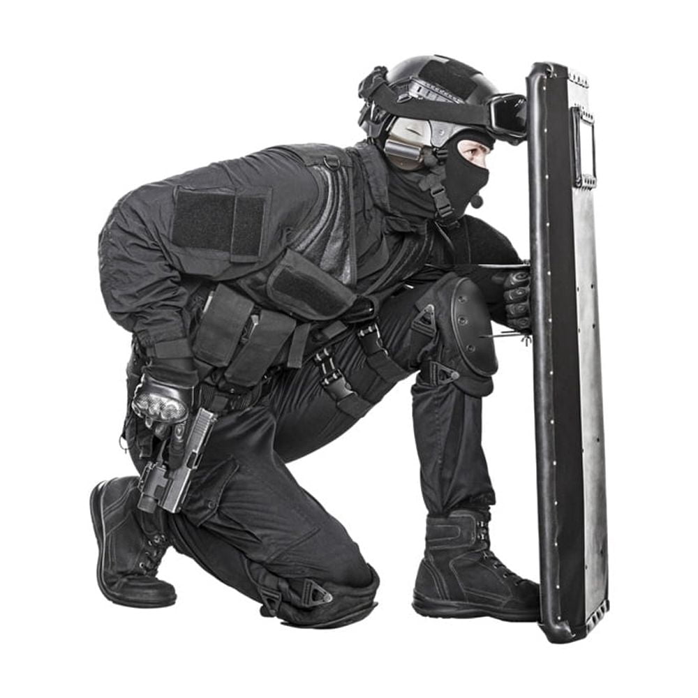 Studio shot of SWAT police special forces with pistol hiding behind ...