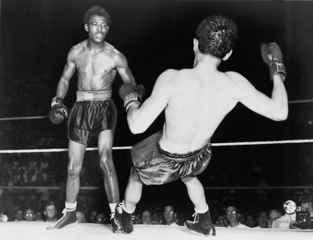 Sugar Ray Robinson Watching Jimmy Doyle Fall Backwards After Receiving ...