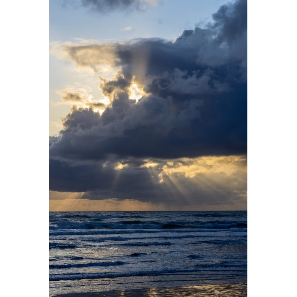 Sunbeams Flow Through Holes In The Clouds Along The Oregon Coast ...