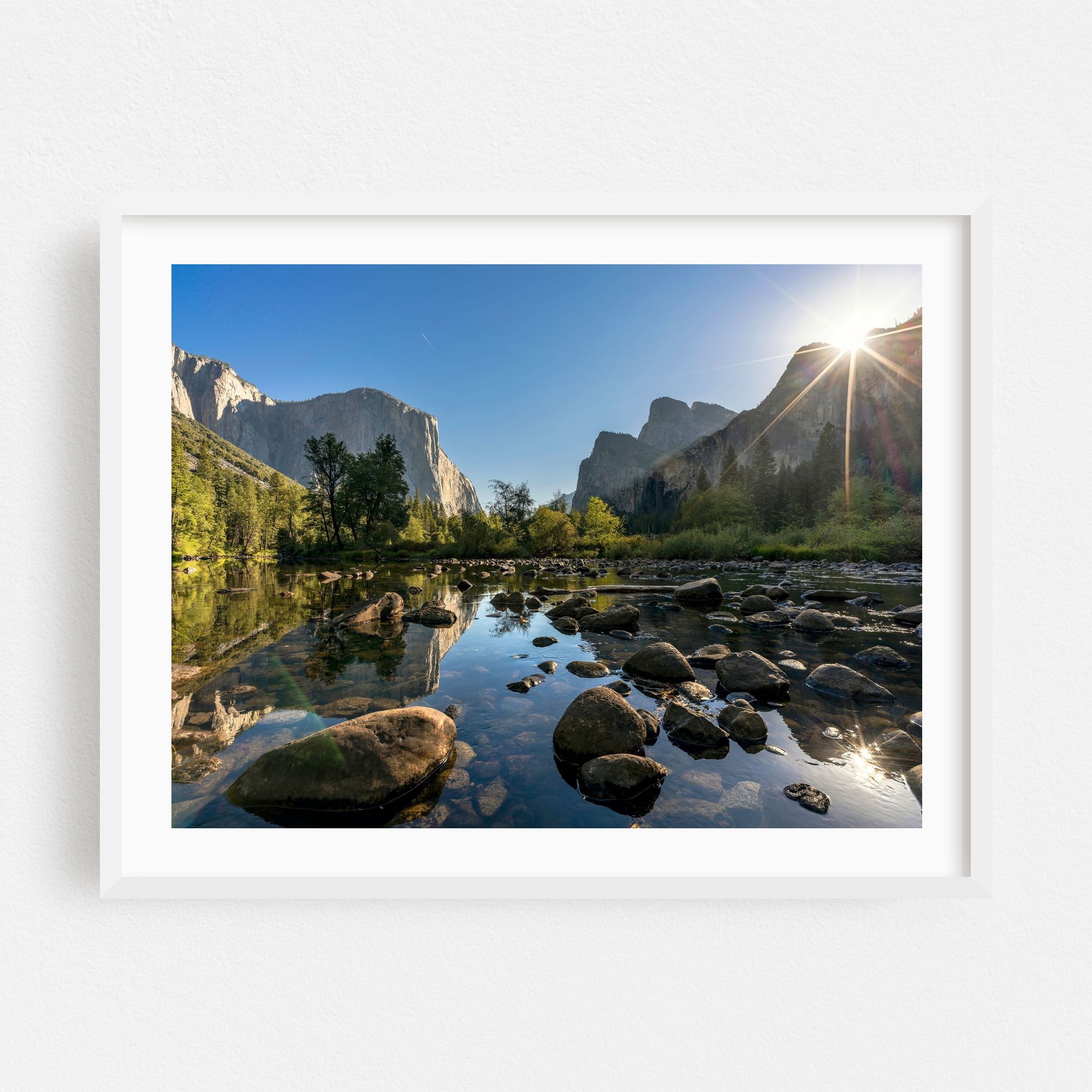 Sunlight dances on the water, highlighting granite cliffs - Photography ...
