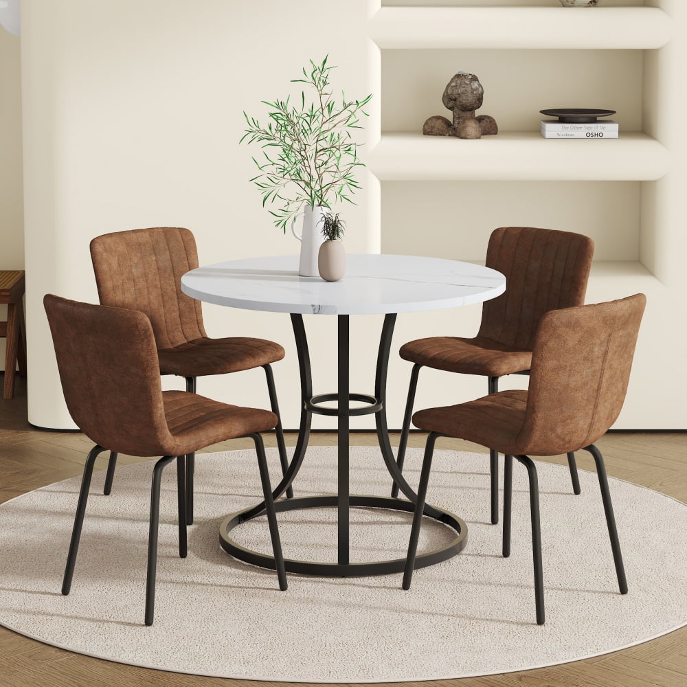Table and chair set.A Modern Minimalist Circular Dining Table With A ...
