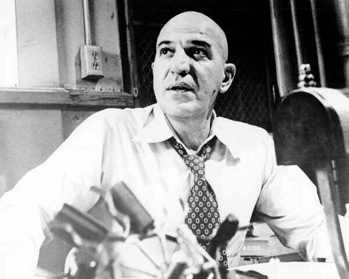 Telly Savalas sat at his desk at 13th Precinct Manhattan as Kojak ...
