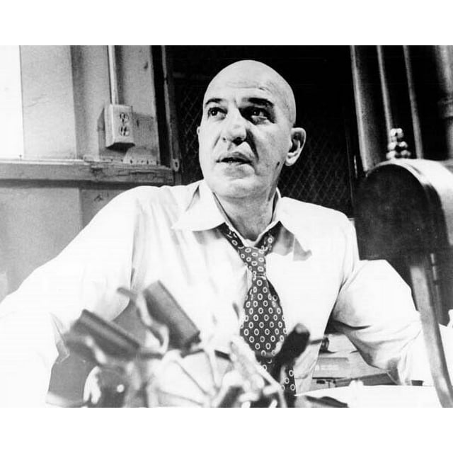 Telly Savalas sat at his desk at 13th Precinct Manhattan as Kojak ...