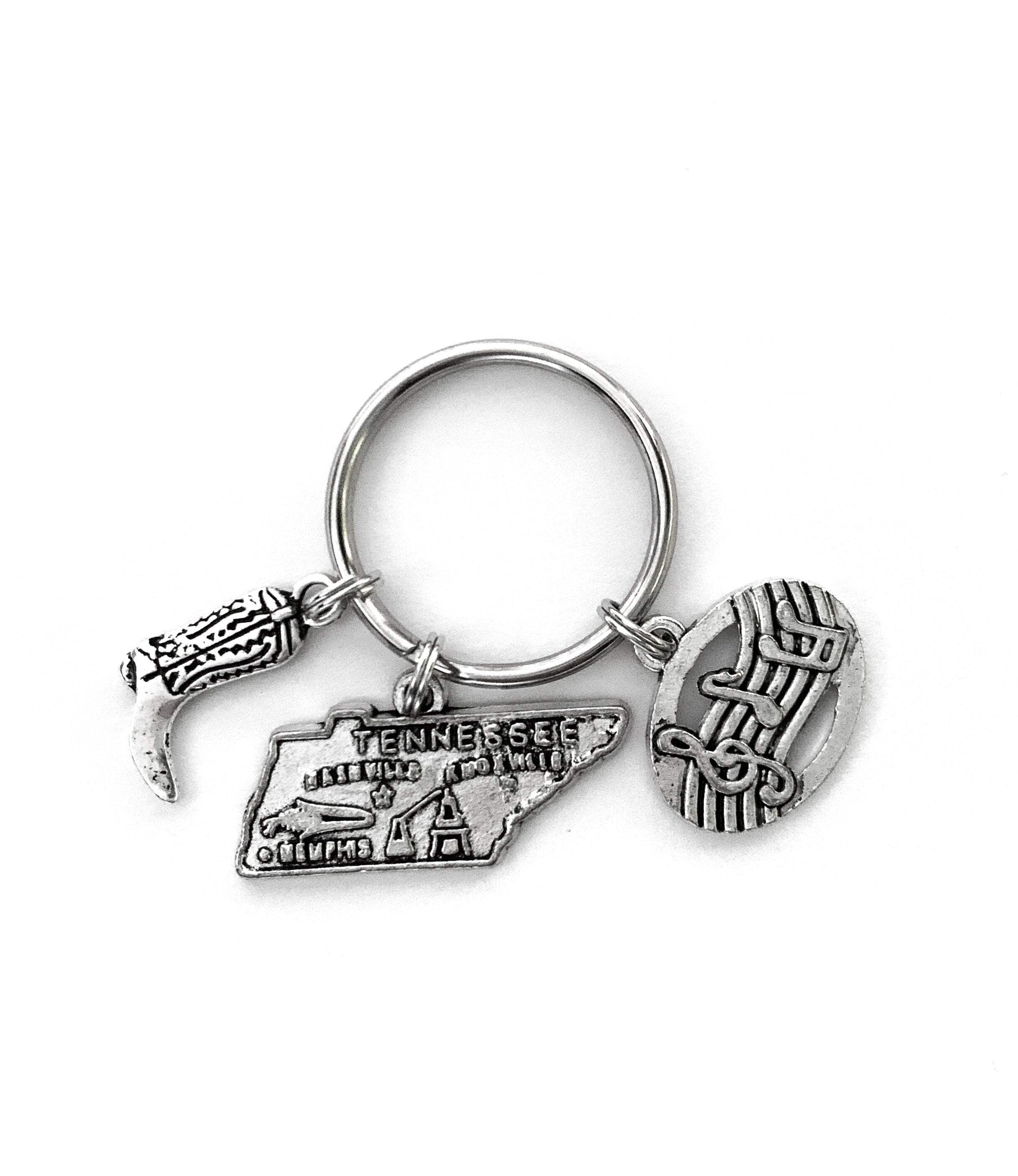 Tennessee themed keychain. Includes State of Tennessee, Musical Notes ...