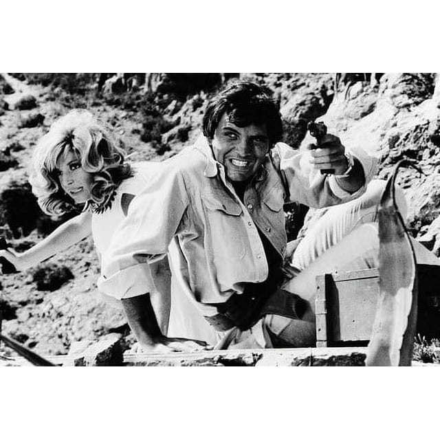 Terence Stamp and Monica Vitti in Modesty Blaise action shot with guns ...