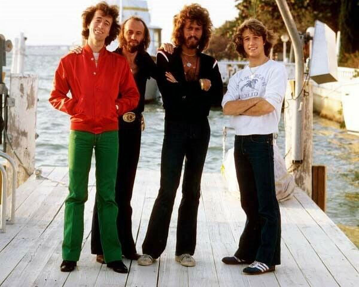 The Bee Gees brothers Barry Robin Maurice & Andy pose on boat dock ...
