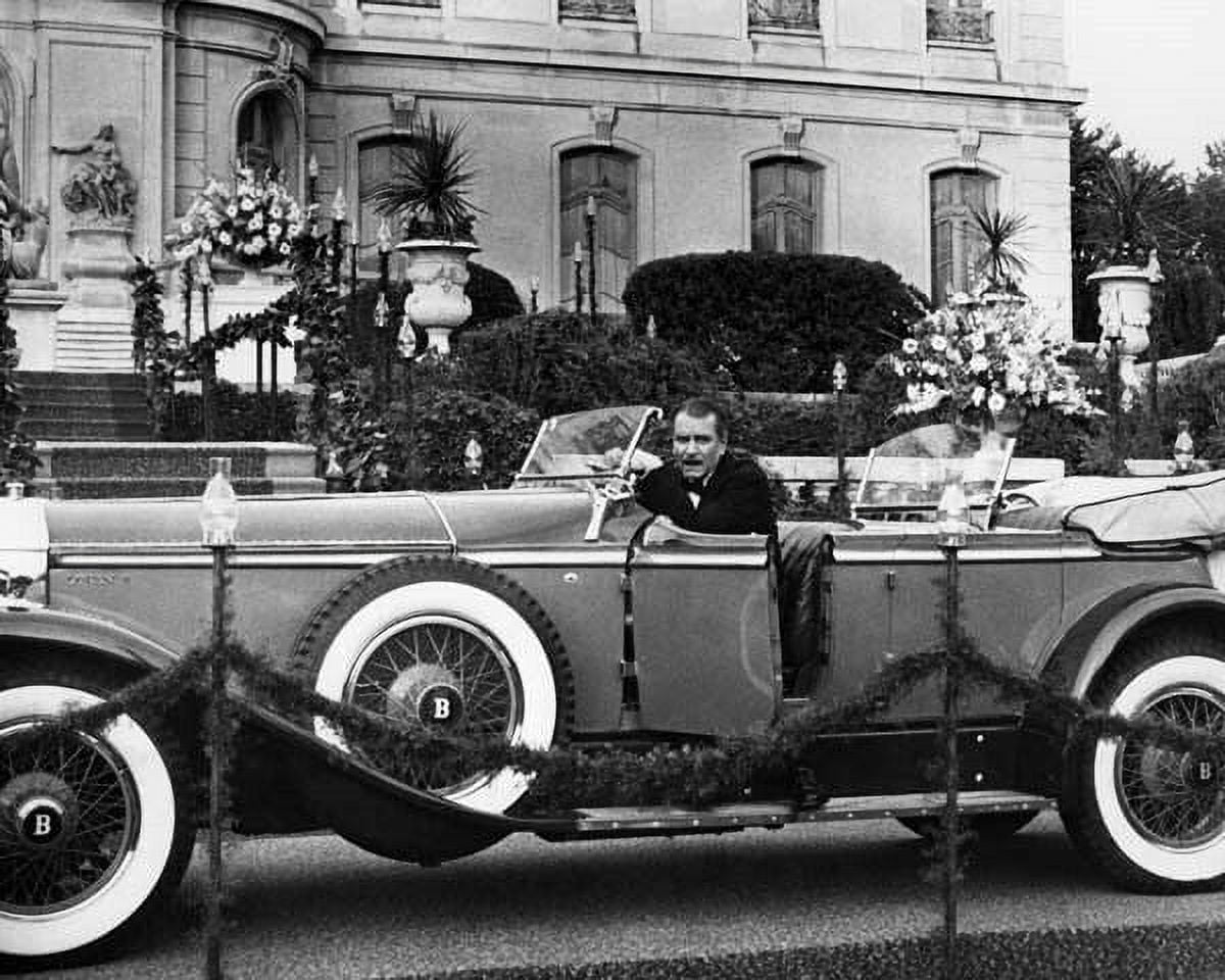 The Betsy 1978 Laurence Olivier exits 1934 Chevrolet outside mansion ...