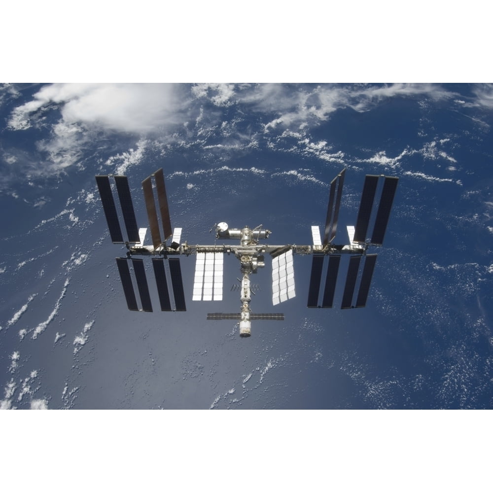 The International Space Station backdropped by a blue and white Earth ...