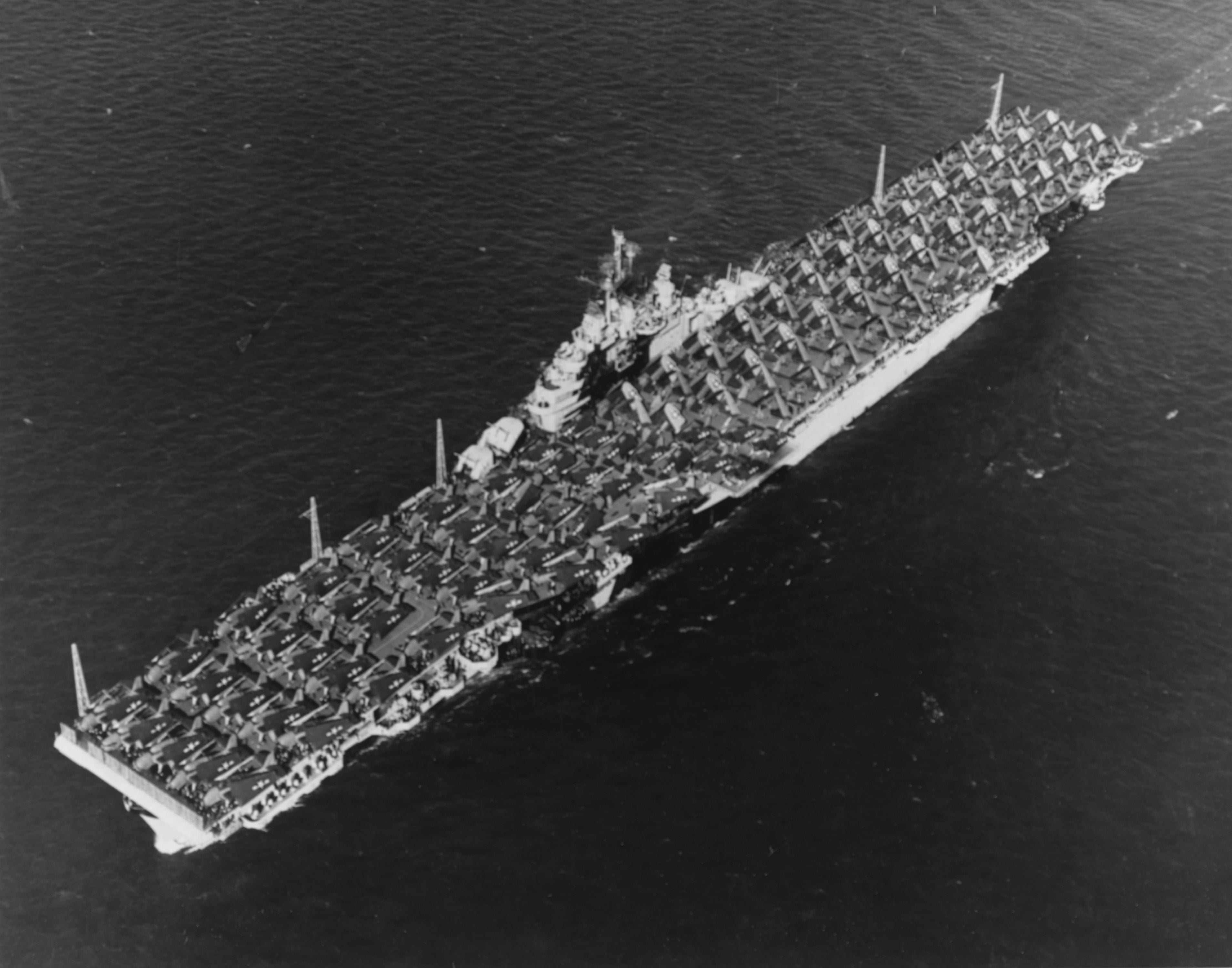 The Us Navy Aircraft Carrier Uss Essex Cv 9 At Sea With An Overload Of Aircraft On Her