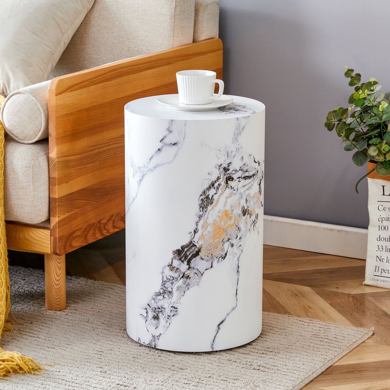 The cylindrical table with its patterned design can be easily ...