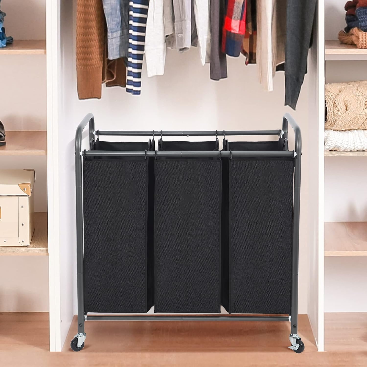 Three-tier, three-compartment laundry basket with wheels, featuring ...