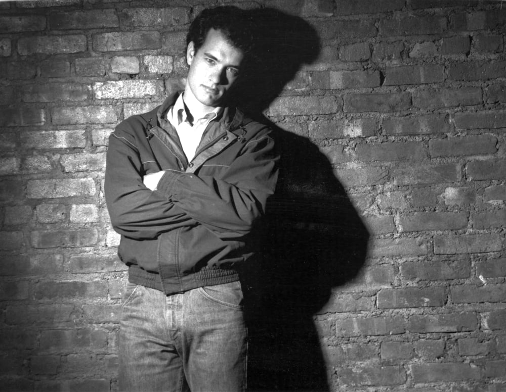 Tom Hanks with arms crossed in front of a brick wall Photo Print (8 x ...