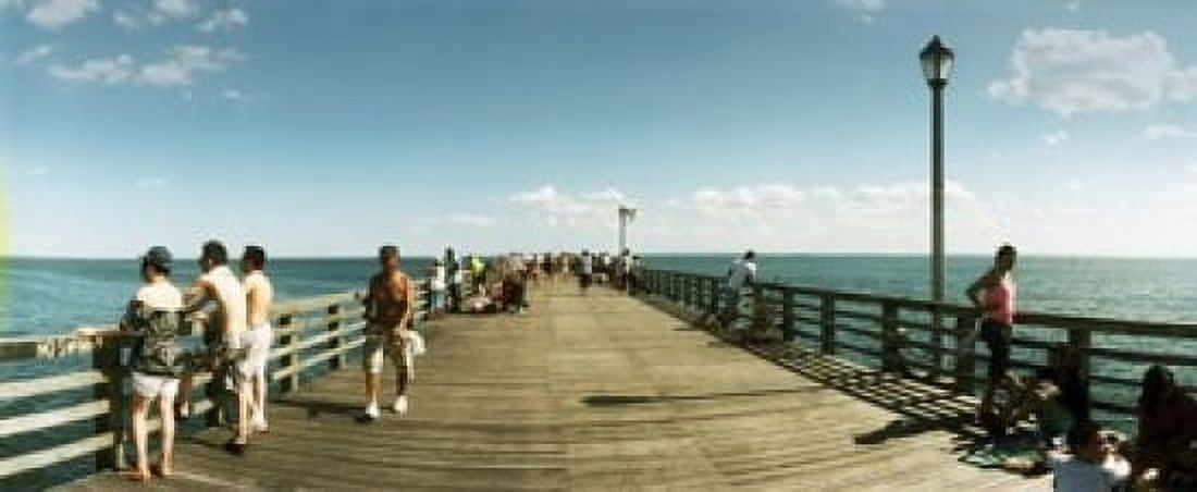 Tourists on the beach at Coney Island viewed from the pier, Brooklyn ...
