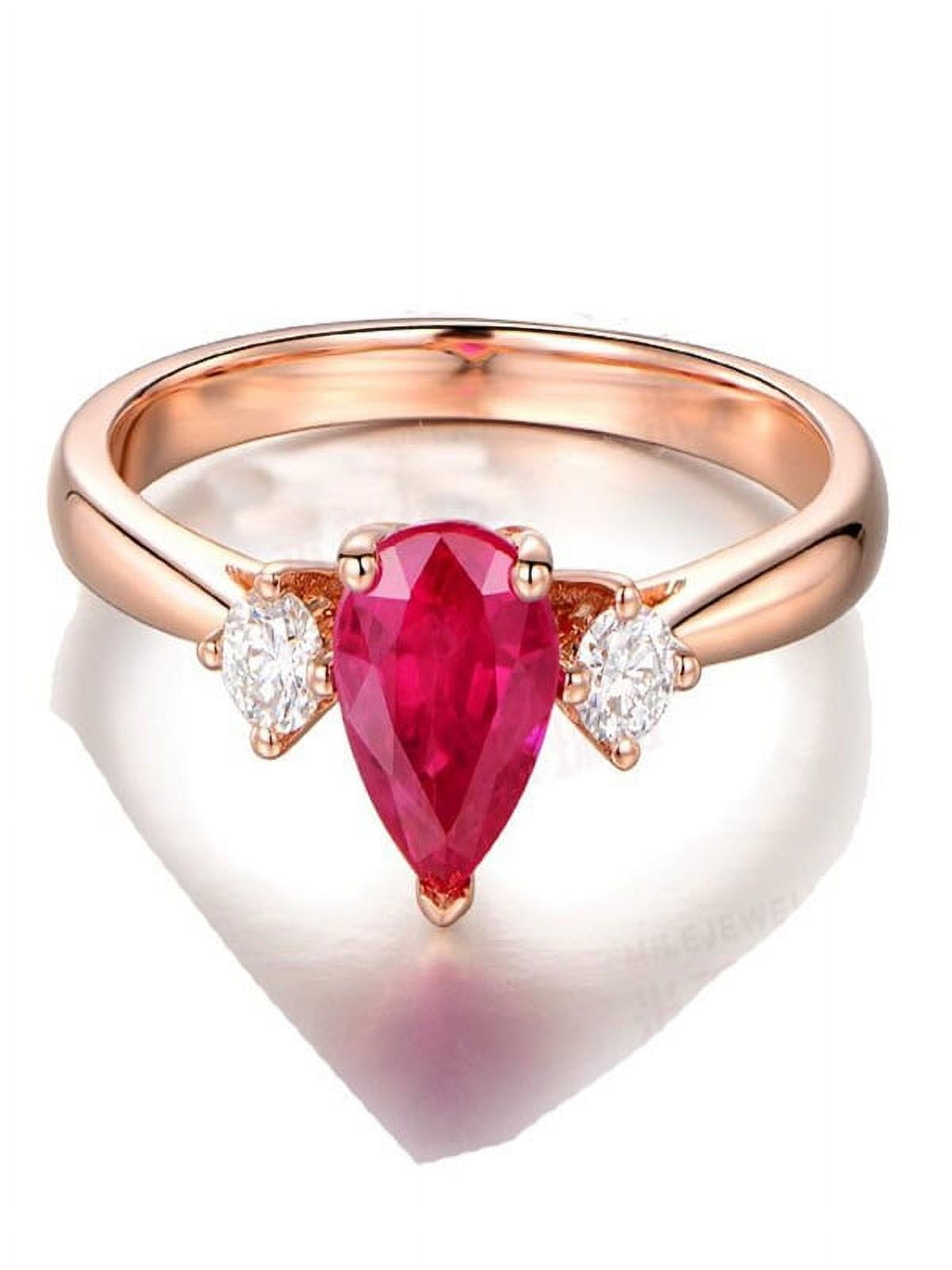 Trilogy Half Carat Pear Shape Ruby And Round Diamond Moissanite Engagement Ring In Rose Gold ...