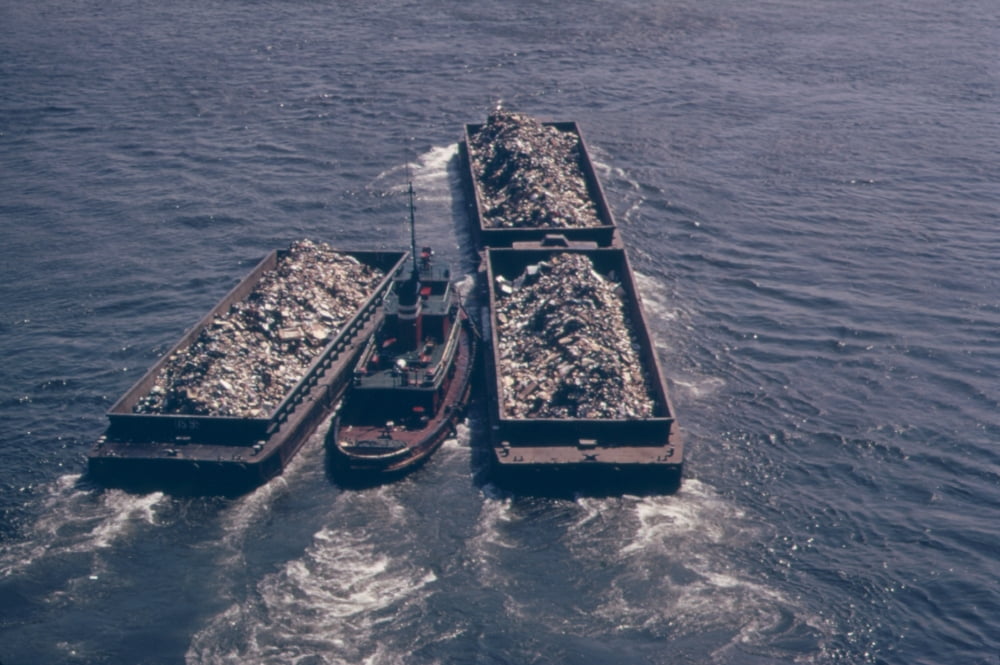 Tug Boats Tow Barges Of Garbage Down The East River To An Overflowing ...