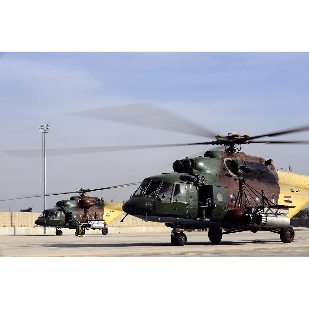 Two Iraqi Mi-17 Hip Helicopters conduct an aeromedical evacuation ...