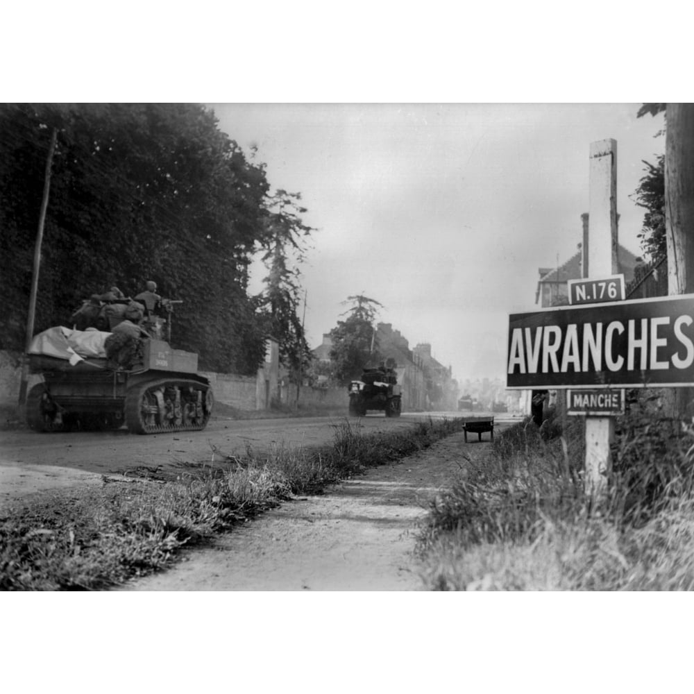 U.S. Light Tanks Passing A Road Sign For The Town Of Avranches History ...