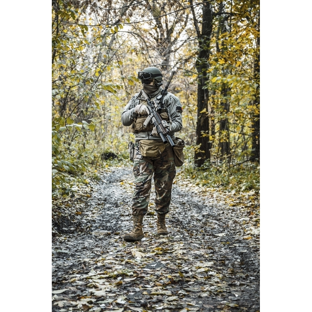 U.S. Marine Corps Marsoc raider with weapon and tactical radio system ...