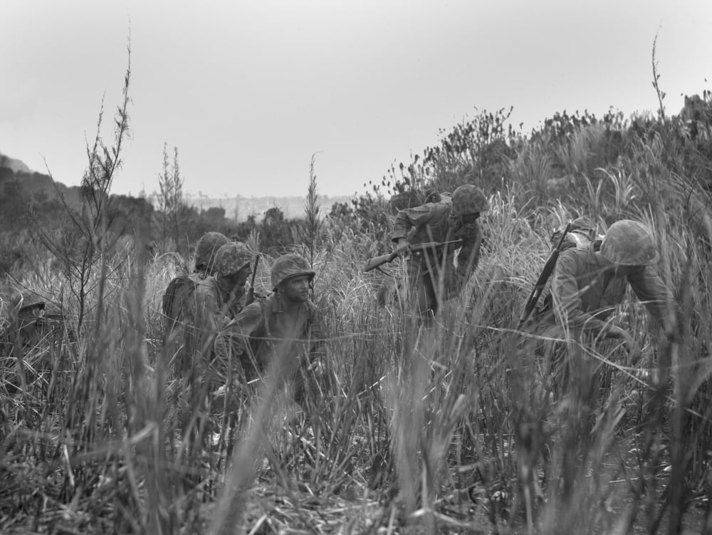 U.S. Marines Patrol On Saipan Advances Through A Grassy Ravine. They ...