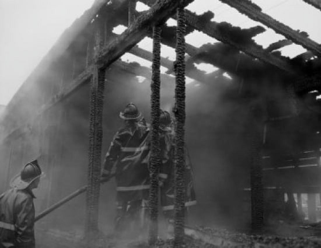 USA, Fireman fighting blaze in burning building Poster Print (24 x 36 ...
