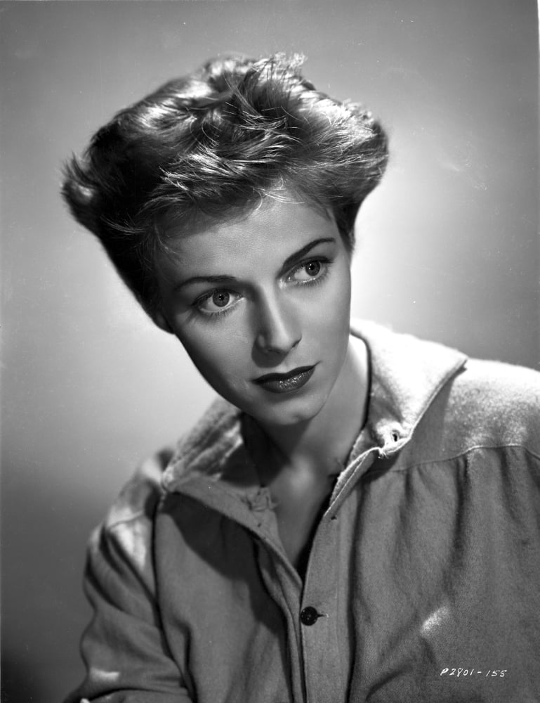 Vera Zorina posed in a wool, button down top, with a wide collar, while ...