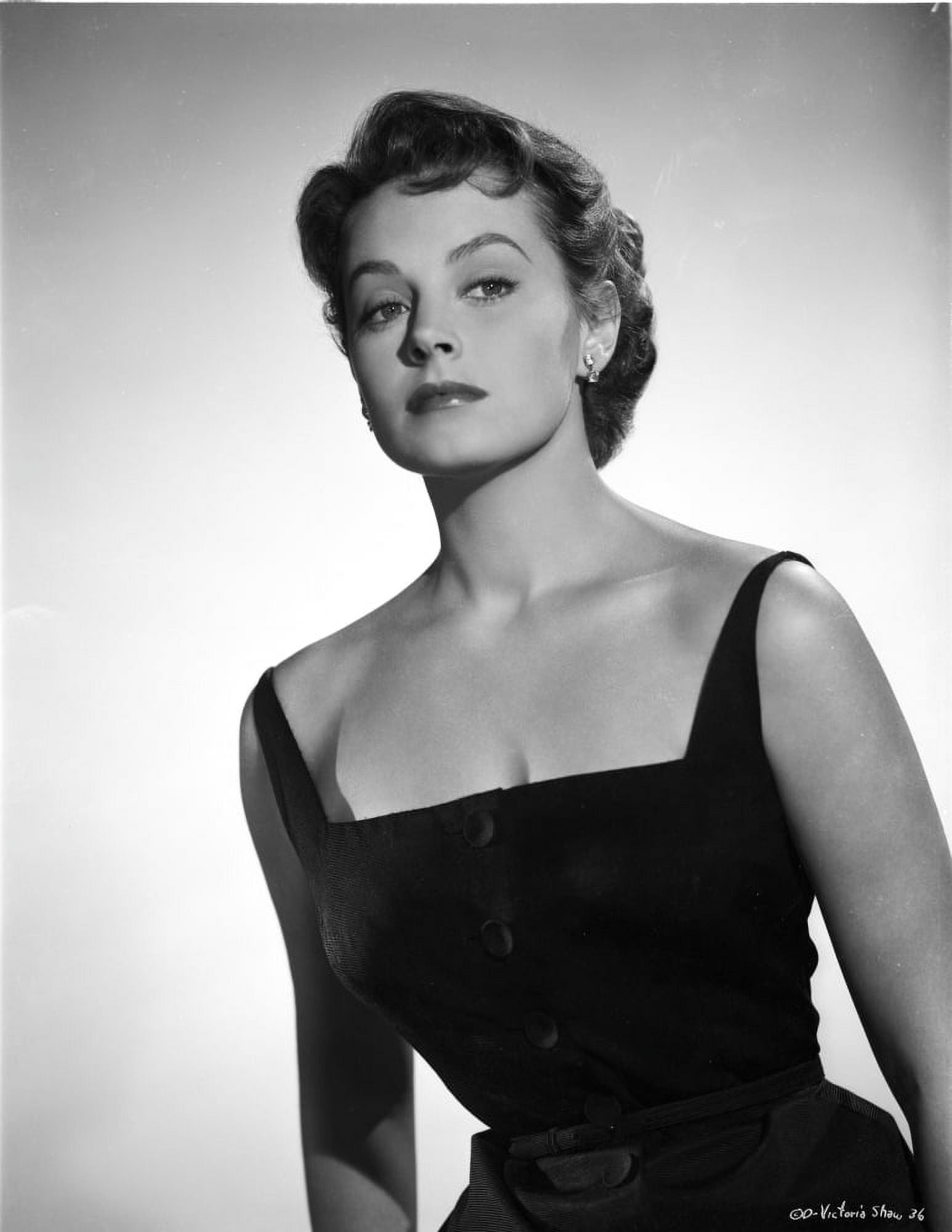 Victoria Shaw posed looking away from the camera with an eyebrow raised ...