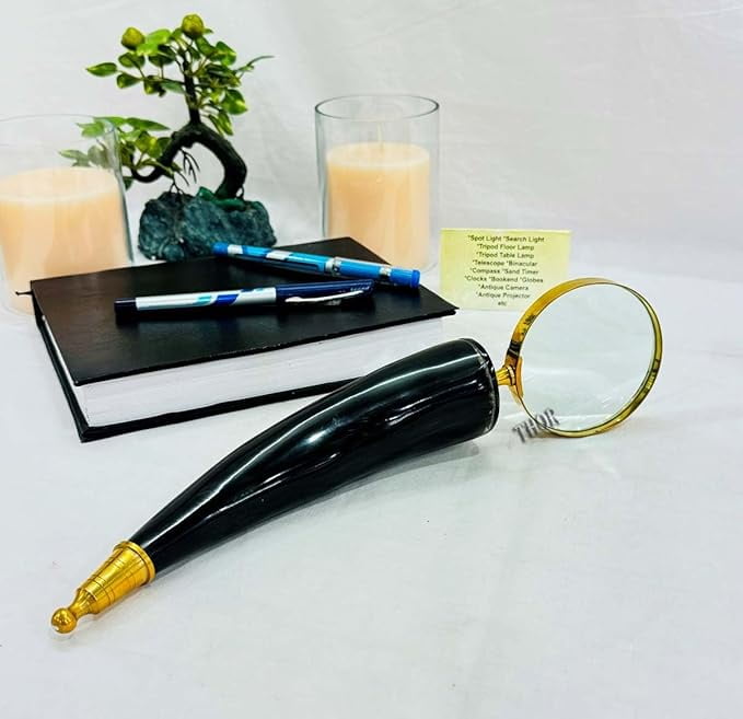 Vintage style magnifying glass hand lens with a horn handle. Old world ...